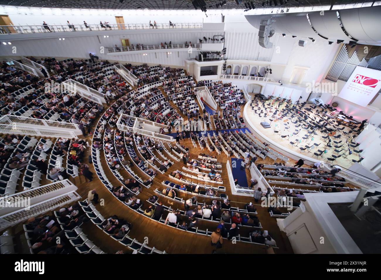 MOSCOW - SEPTEMBER 8: Side view of people sit down on seats prior to IV ...
