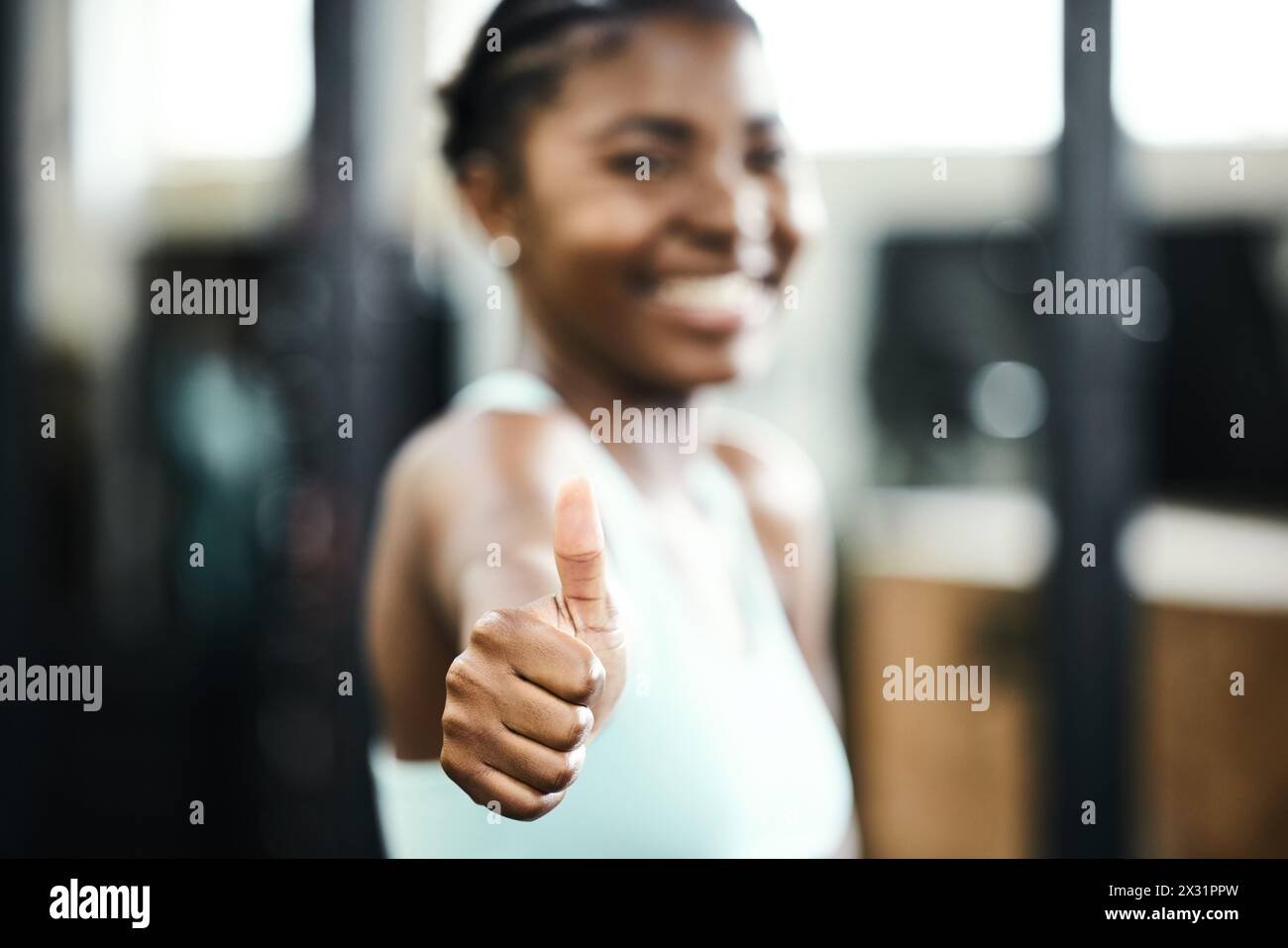 Fitness, thumbs up and portrait of black woman in gym for cardio ...