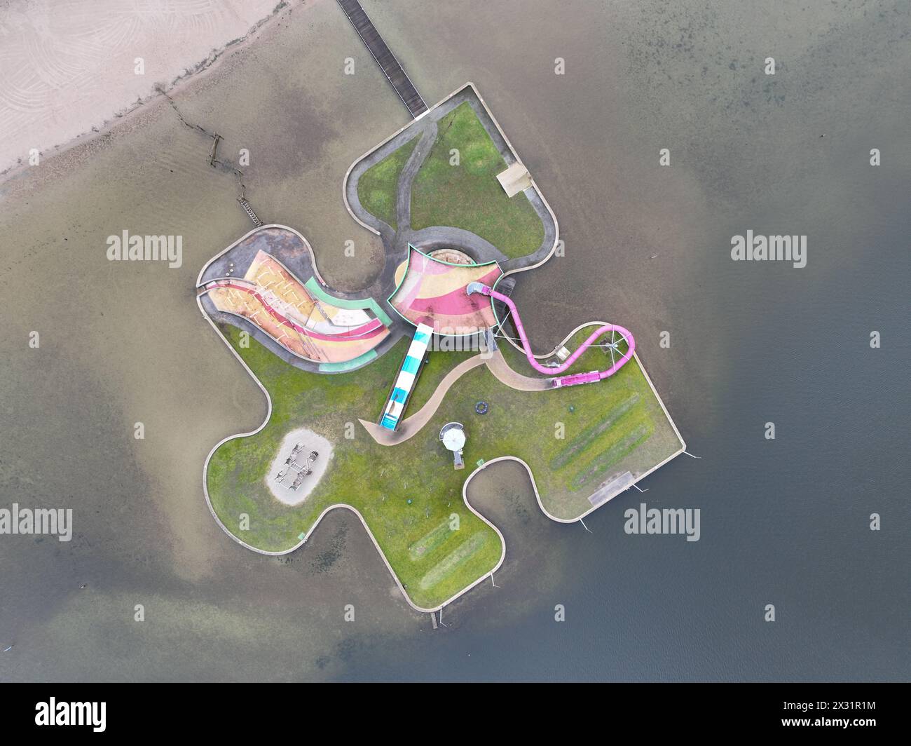 Aerial drone view children playground in the form of a puzzle piece ...