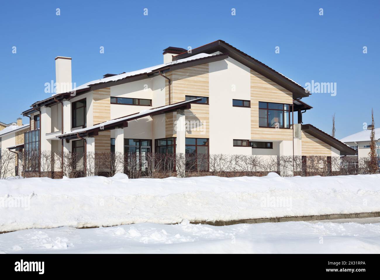 Modern cottage with big windows at frosty and sunny winter day Stock ...