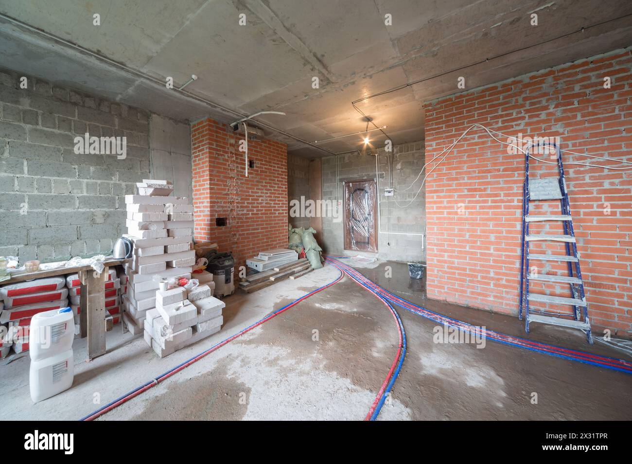 Room with universal gypsum plaster and others building materials in a ...