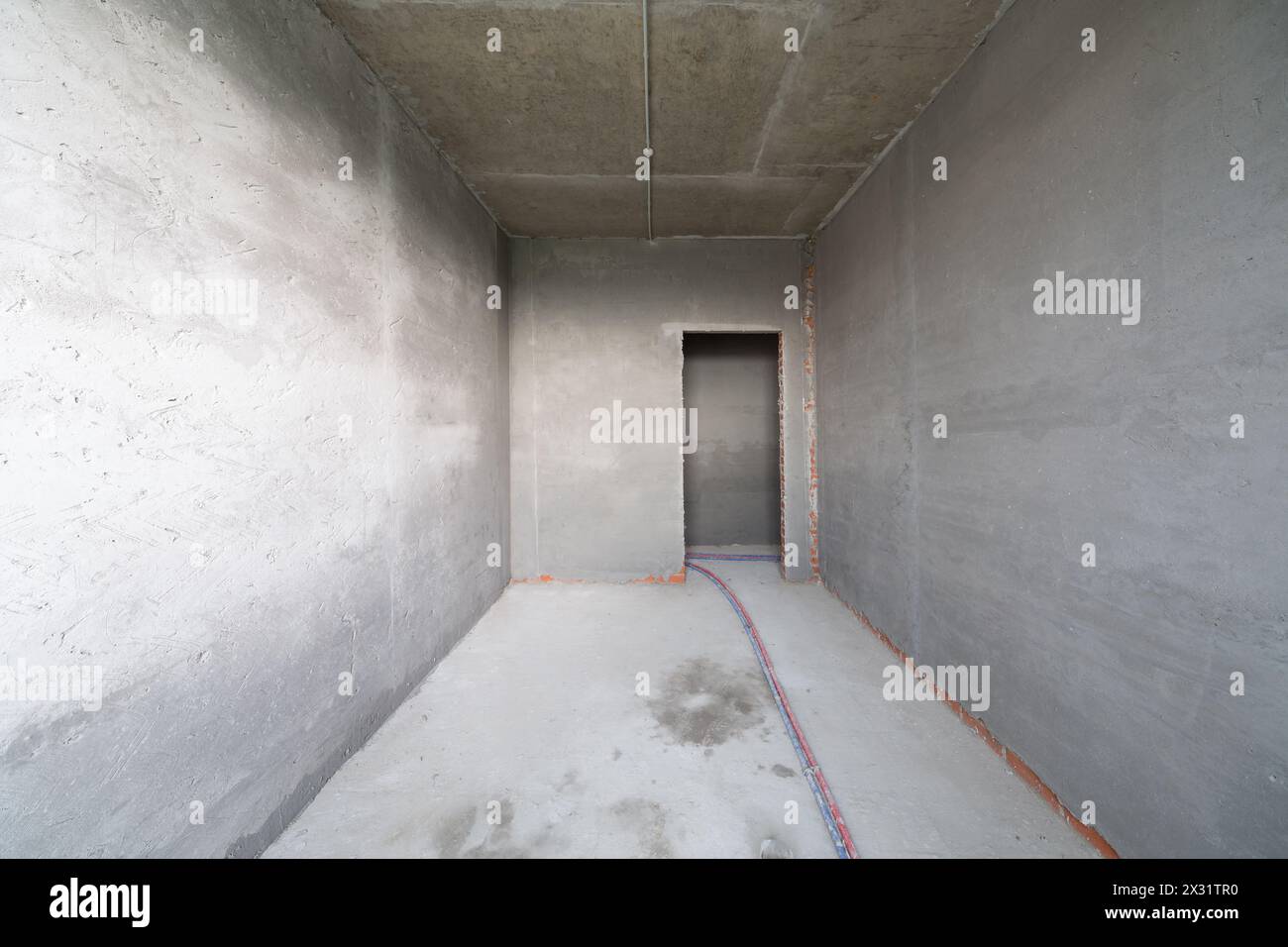 Empty room with a rough finish in a construction residential building ...