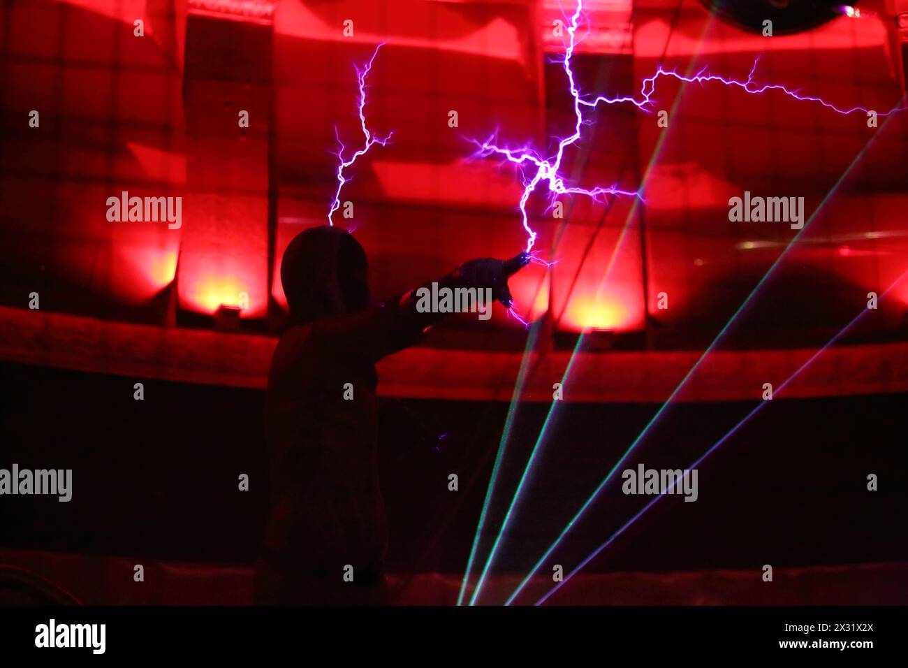 MOSCOW - FEBRUARY 8: Man lets out lightning from finger at presentation ...