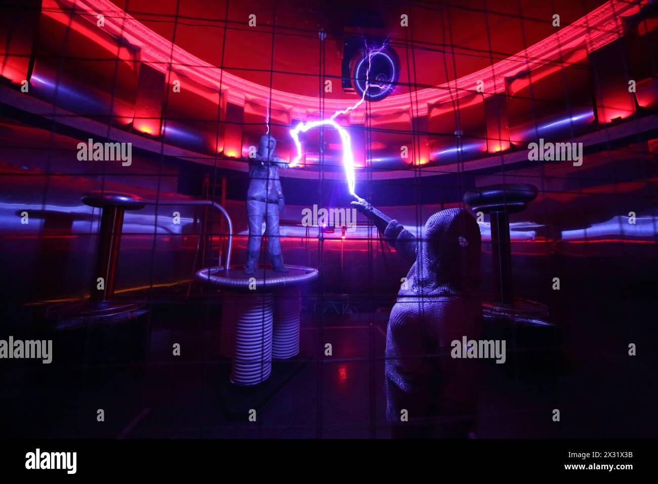 MOSCOW - FEBRUARY 8: Two men in special clothes hold lightning at ...