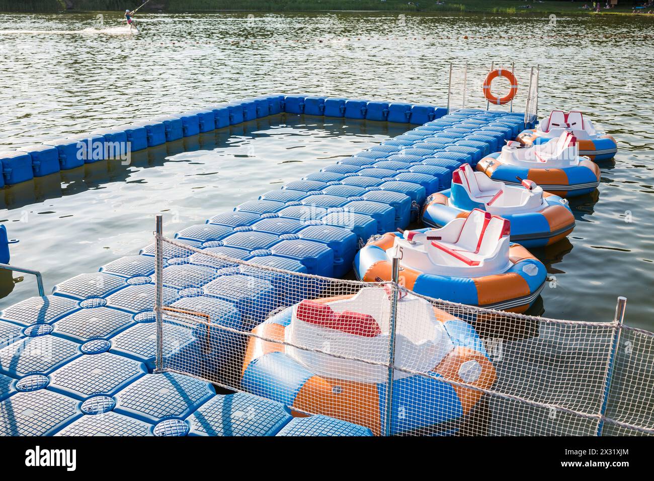 Round inflatable boat with electric motor stand in the dock Stock Photo ...