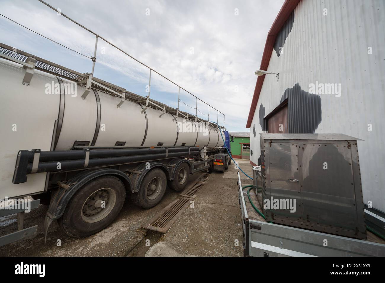 Truck stand near a barn for the production of milk loading Stock Photo ...