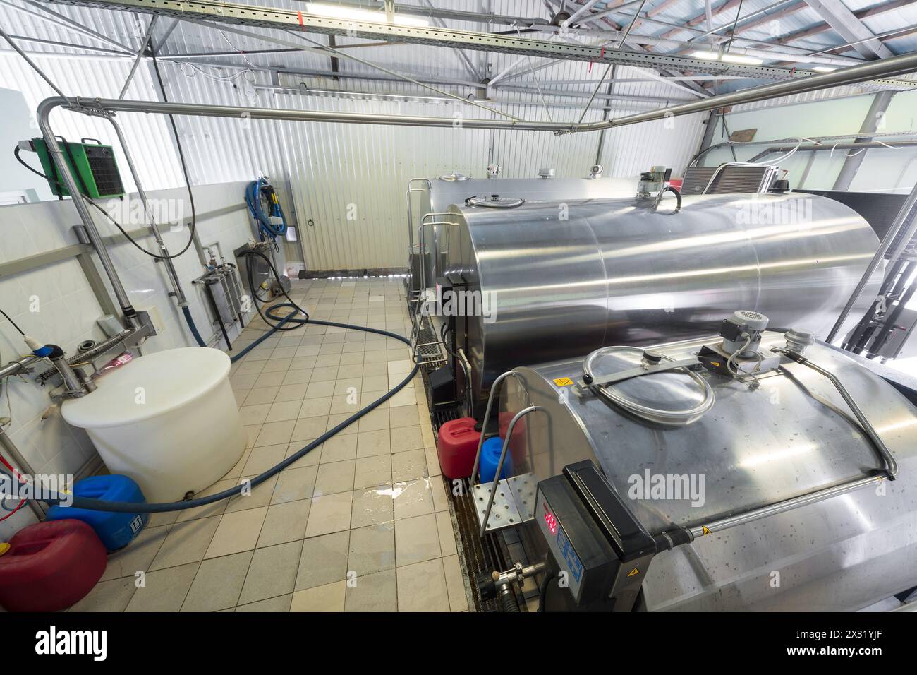 The workshop in the dairy farm with chrome tanks for milk Stock Photo ...
