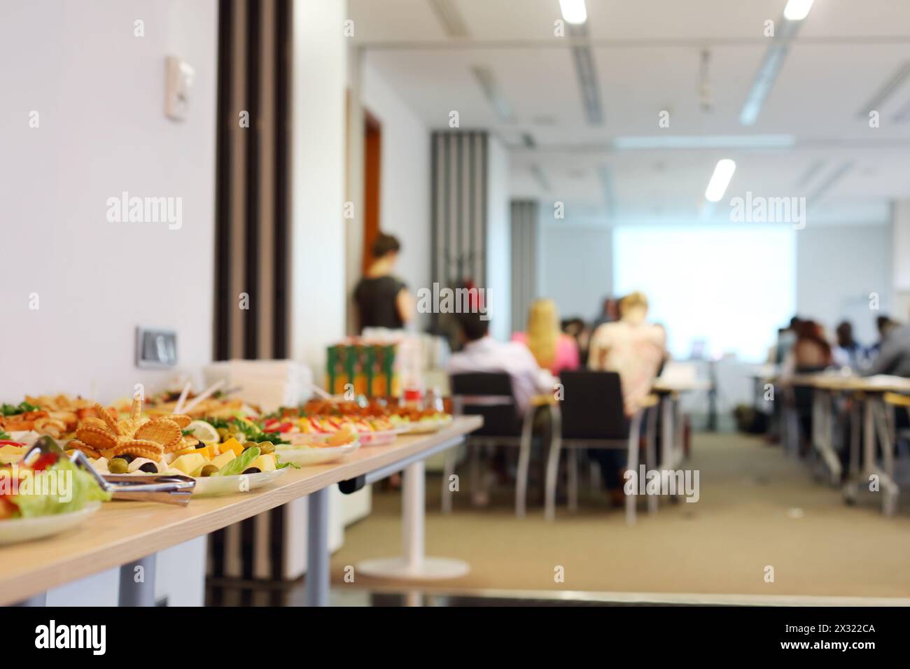 Table with cold snacks and refreshments for business meeting. Focus on ...