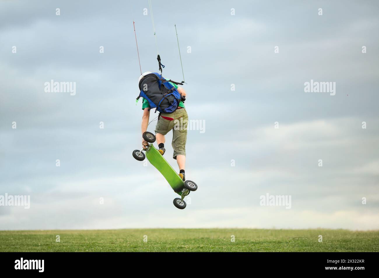 A sportsman does the trick in the air during landkiting on the ...