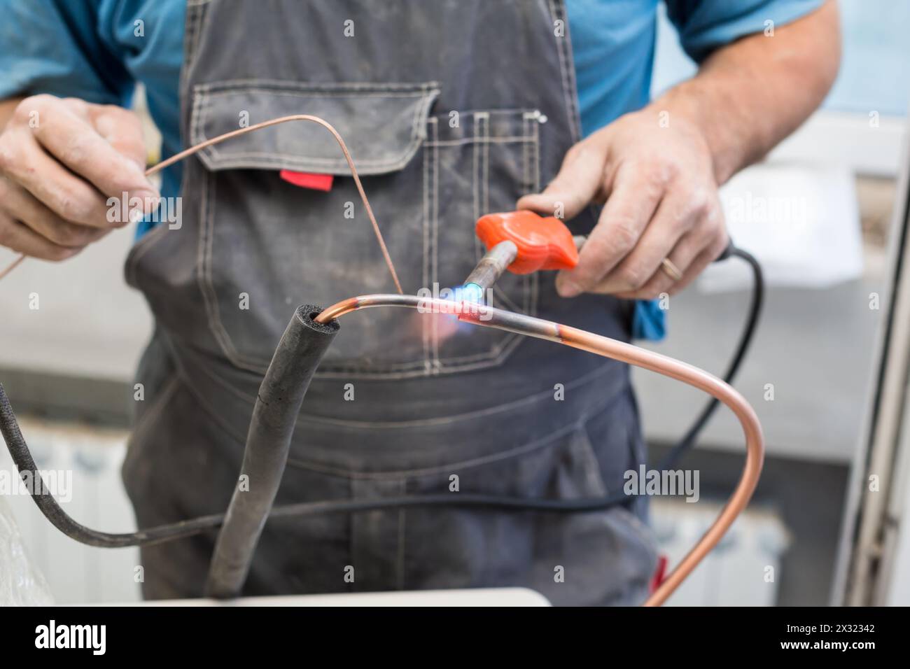 Worker the air conditioner pipe welds oxyfuel gas welding Stock Photo ...