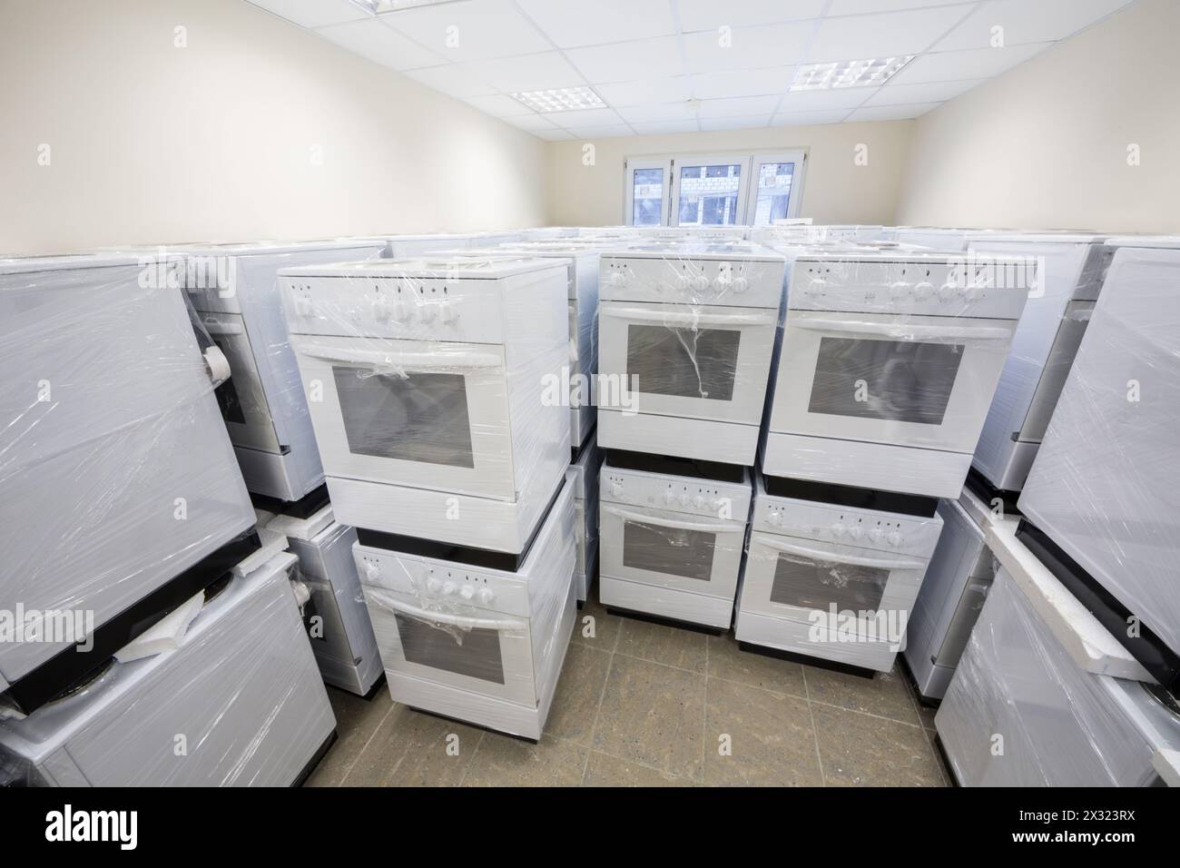 Clear warehouse electric stoves with window Stock Photo - Alamy