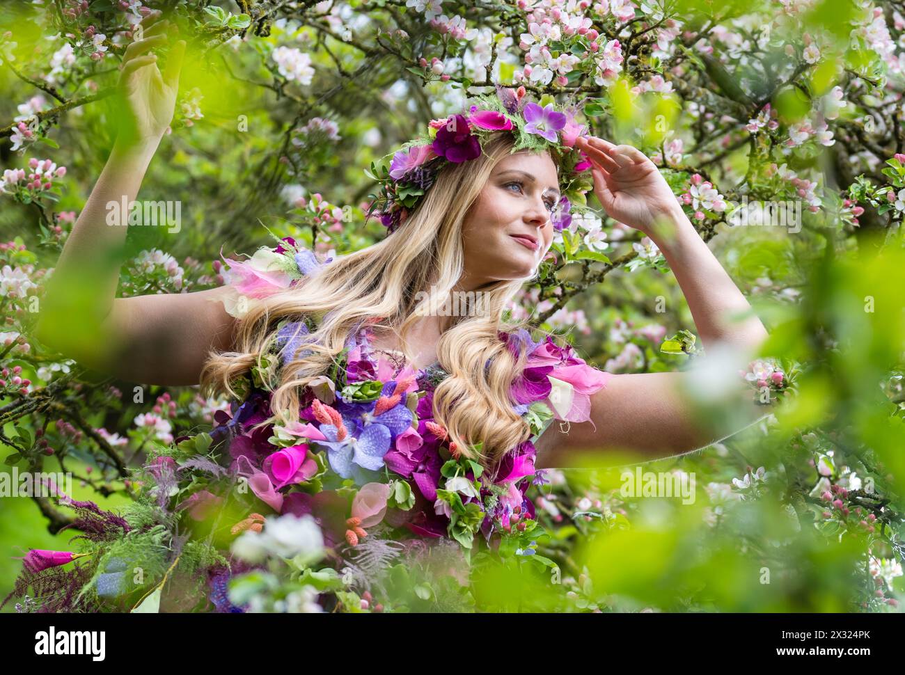 Lucy Kent models a floral gown and headdress created by award-winning ...
