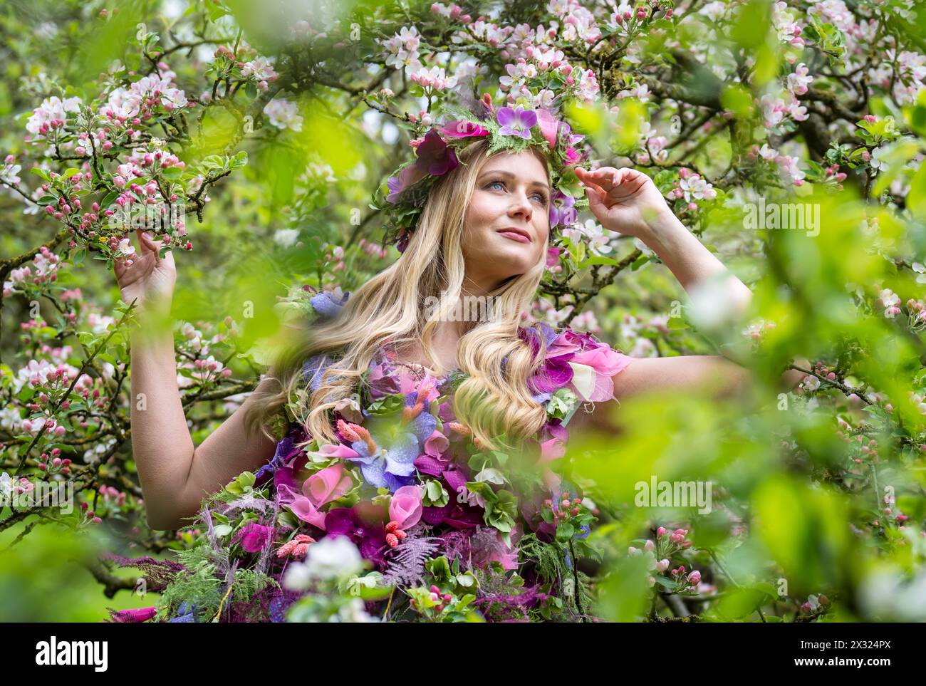 Lucy Kent models a floral gown and headdress created by award-winning ...