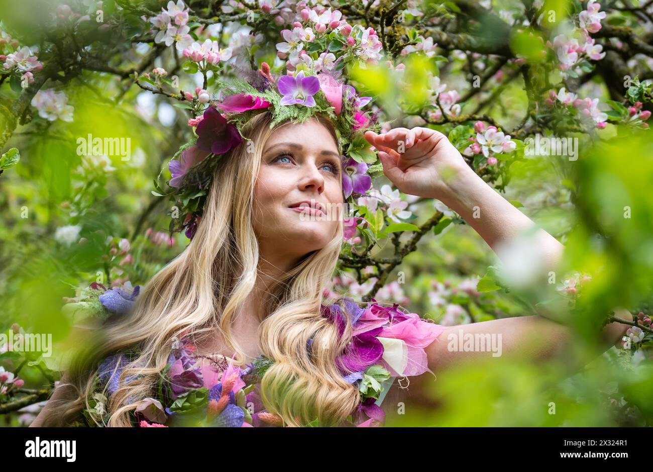 Lucy Kent models a floral gown and headdress created by award-winning ...