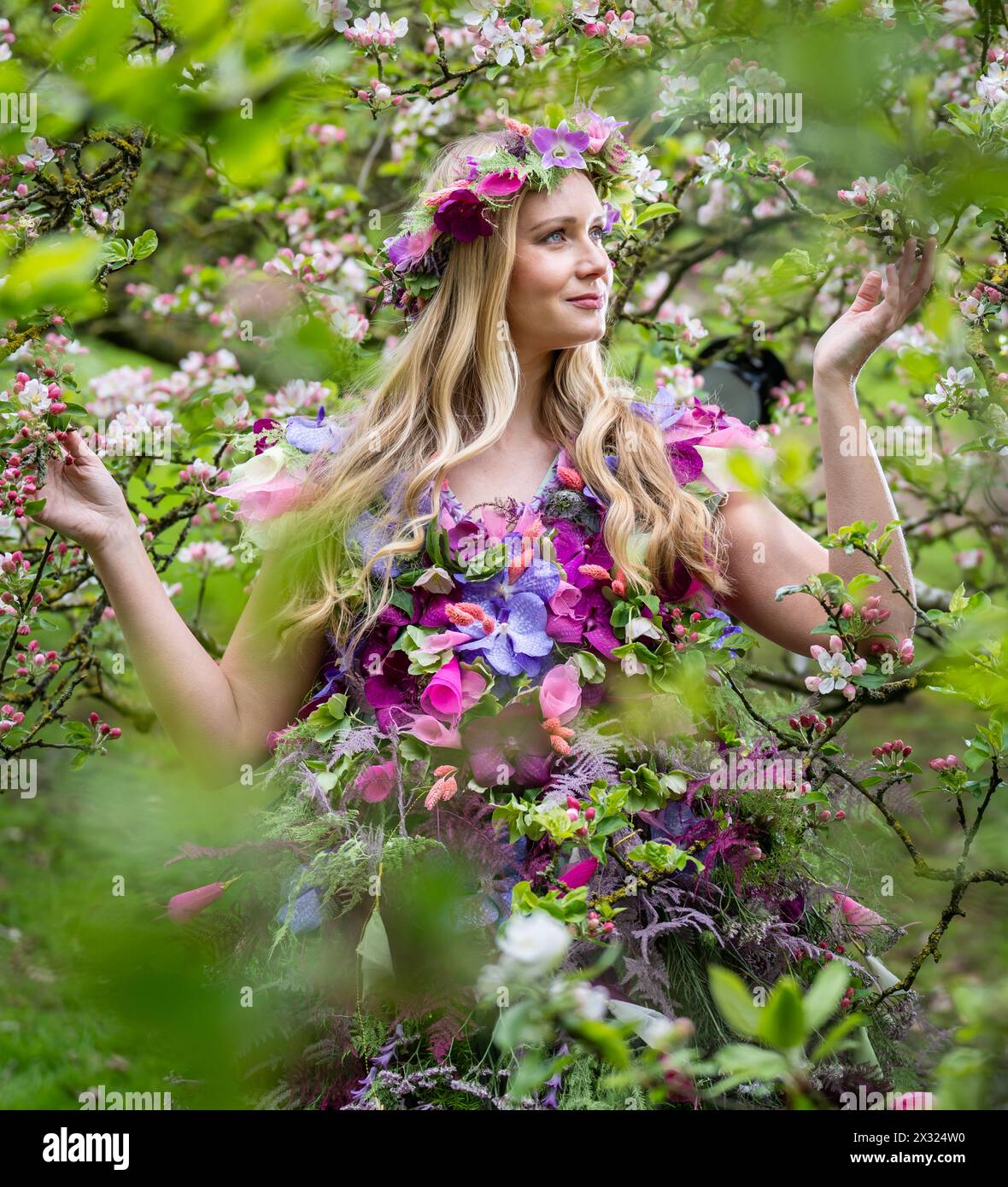 Lucy Kent models a floral gown and headdress created by award-winning ...
