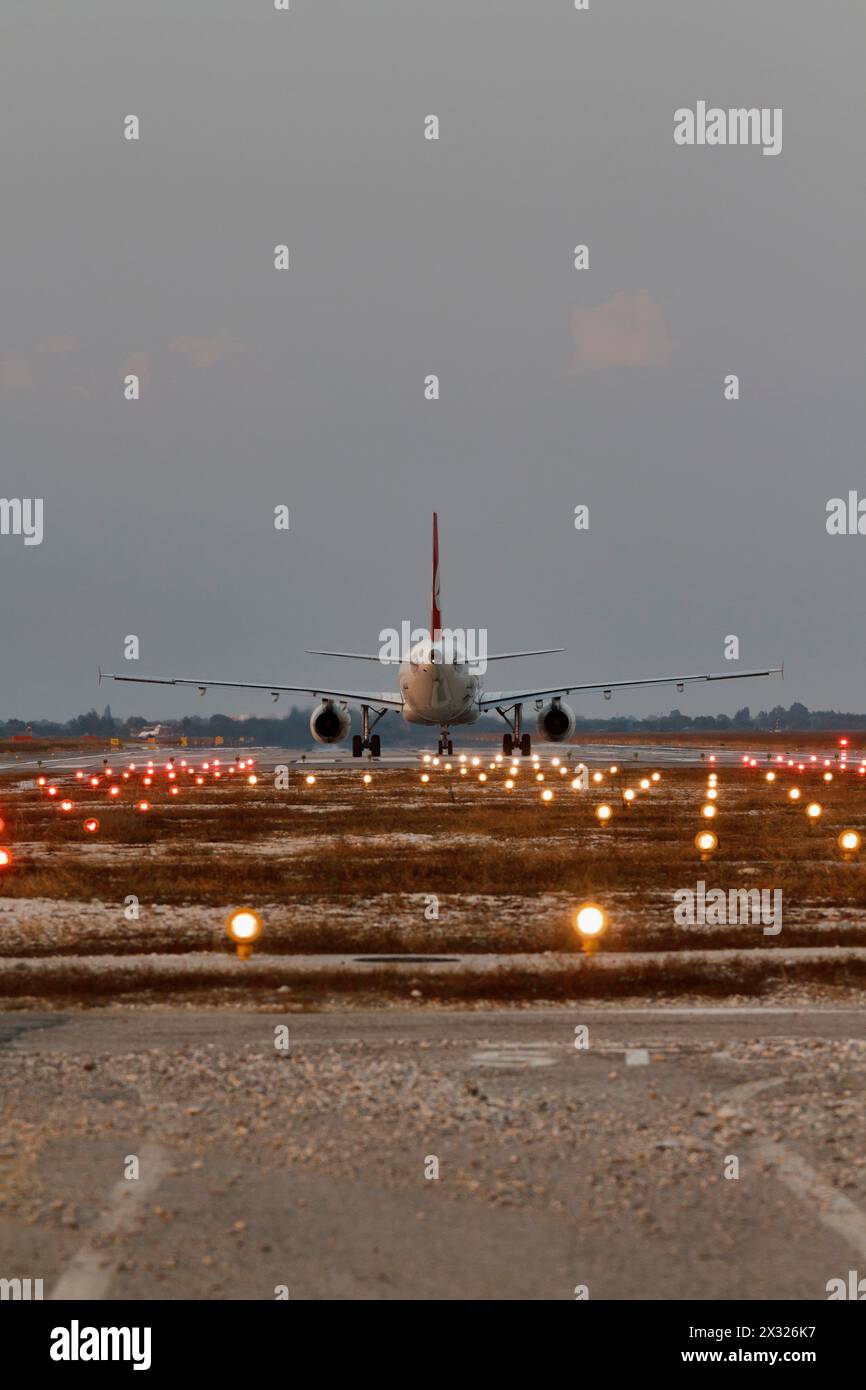 Italy, Venice International Airport, landing strip lights and aircraft ...