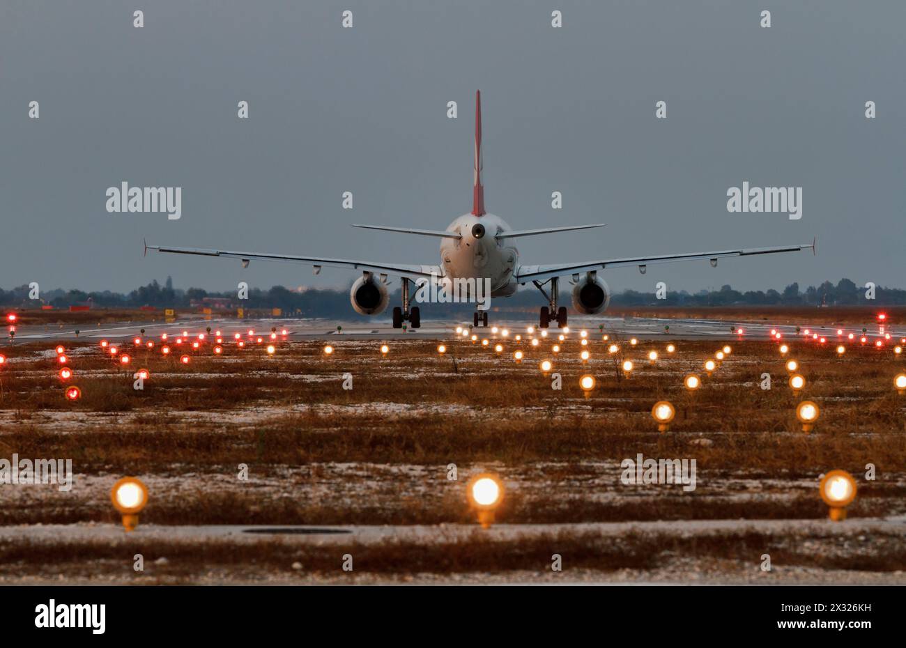 Italy, Venice International Airport, landing strip lights and aircraft ...