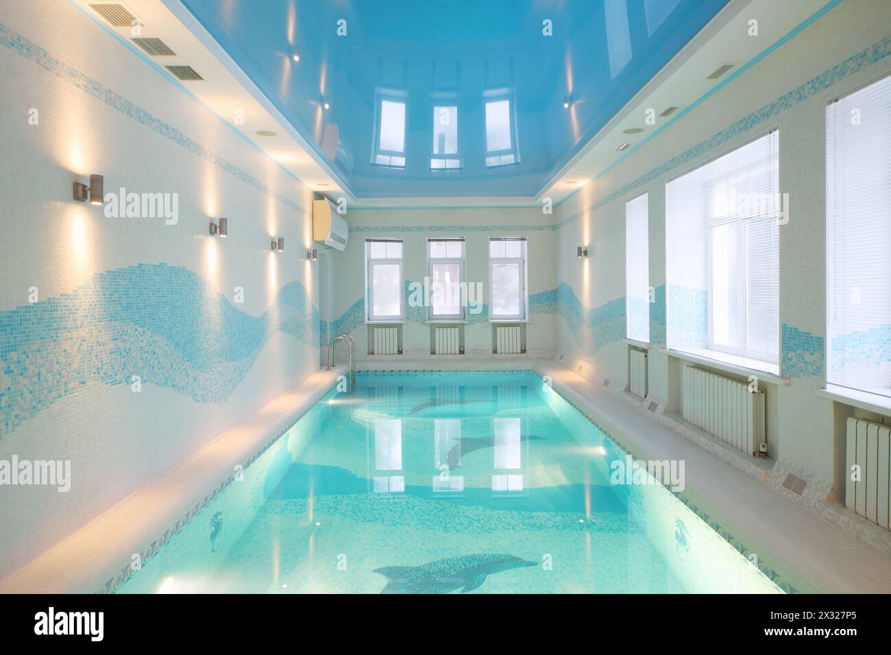 Beautiful pool with images of dolphins at bottom and clear water in big ...