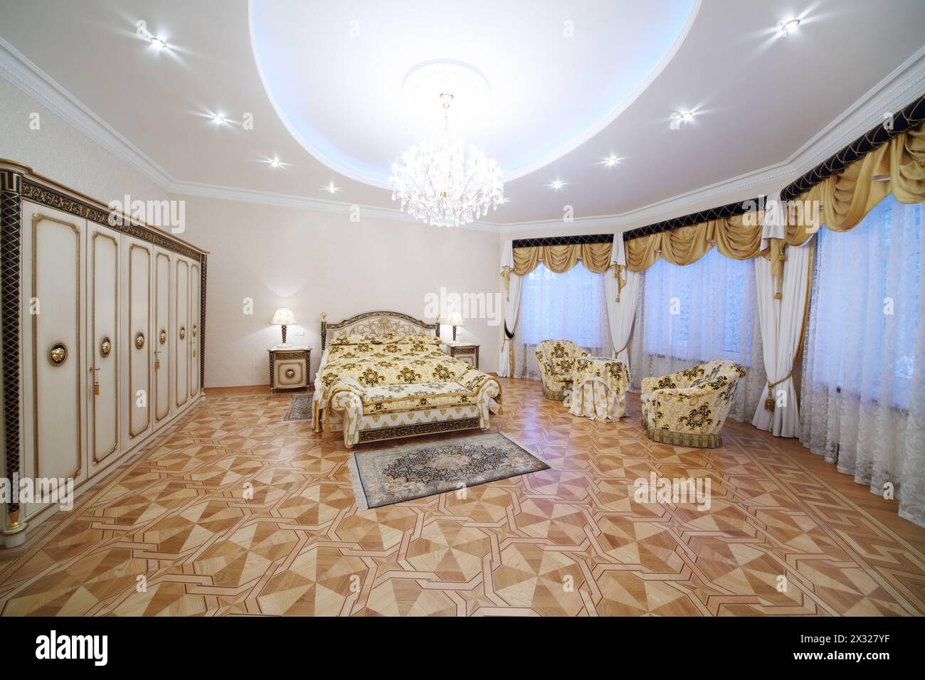 Luxurious bedroom with beautiful double bed, wardrobe in classic style ...