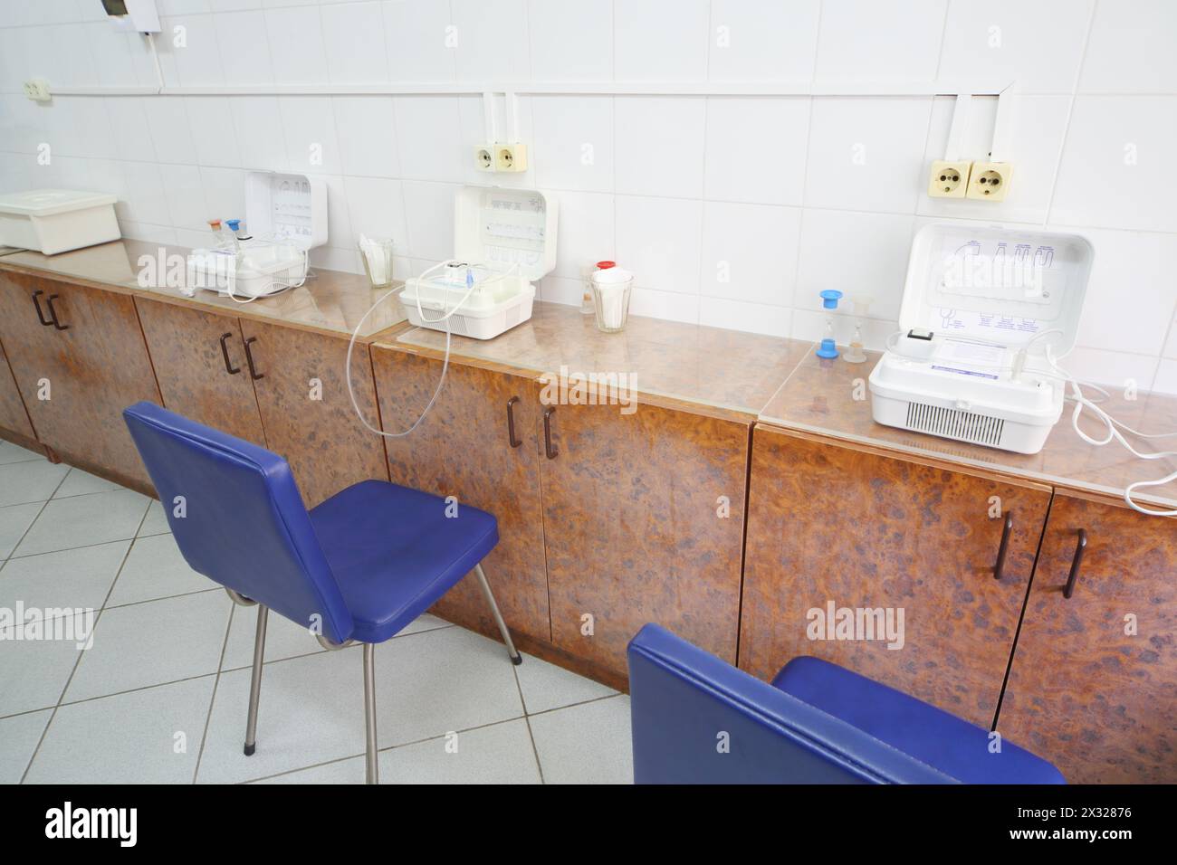 Room for inhalation with three inhalers on the table and chairs Stock ...