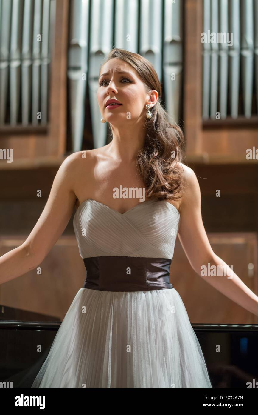 Beautiful opera singer sings emotionally in the concert hall Stock ...