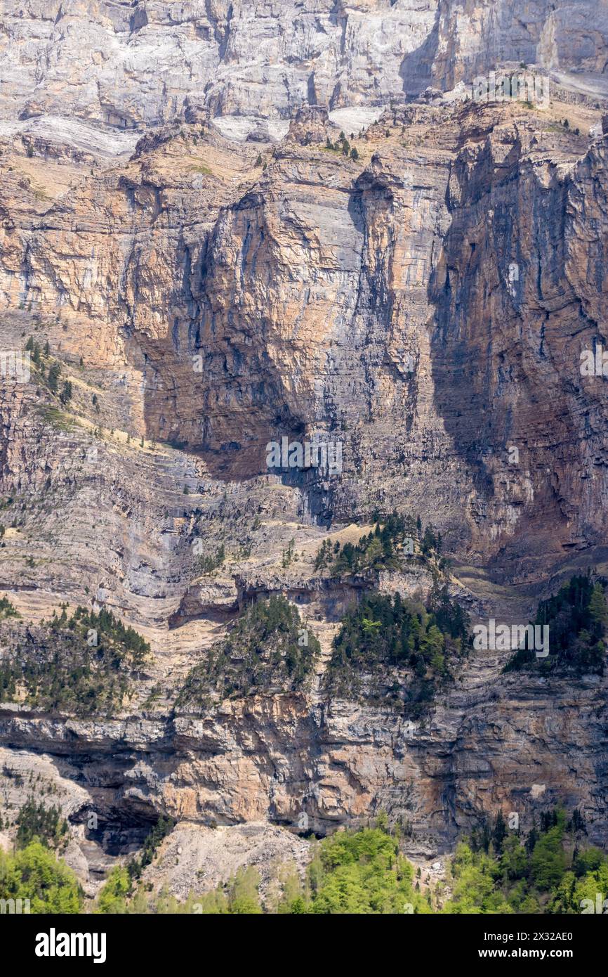 detailed rocky mountain face with layers and textures, showcasing ...