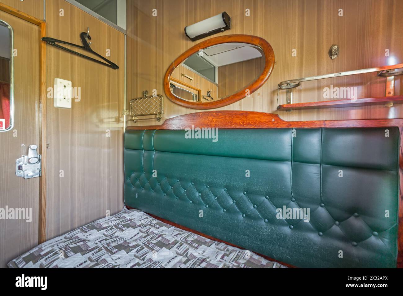 Interior compartment on the train with a mirror and a sofa Stock Photo ...
