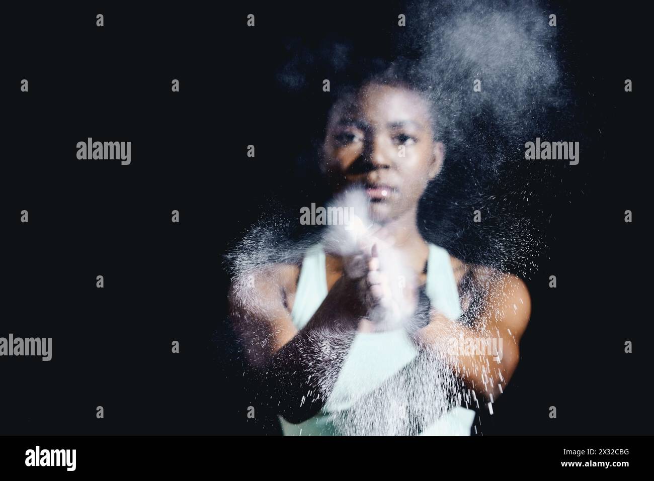 Portrait, black girl and talcum powder in gym to reduce skin friction ...