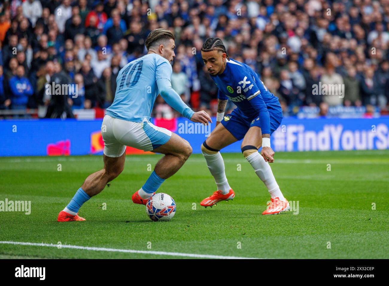 Jack Grealish of Manchester City defended by Malo Gusto of Chelsea- Manchester City v Chelsea ...
