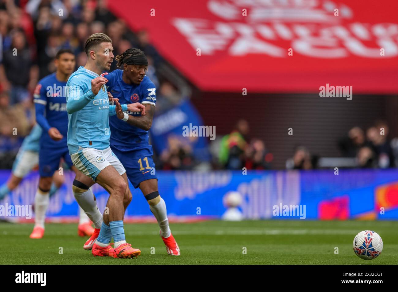 Jack Grealish of Manchester City under pressure from Noni Madueke of Chelsea- Manchester City v ...