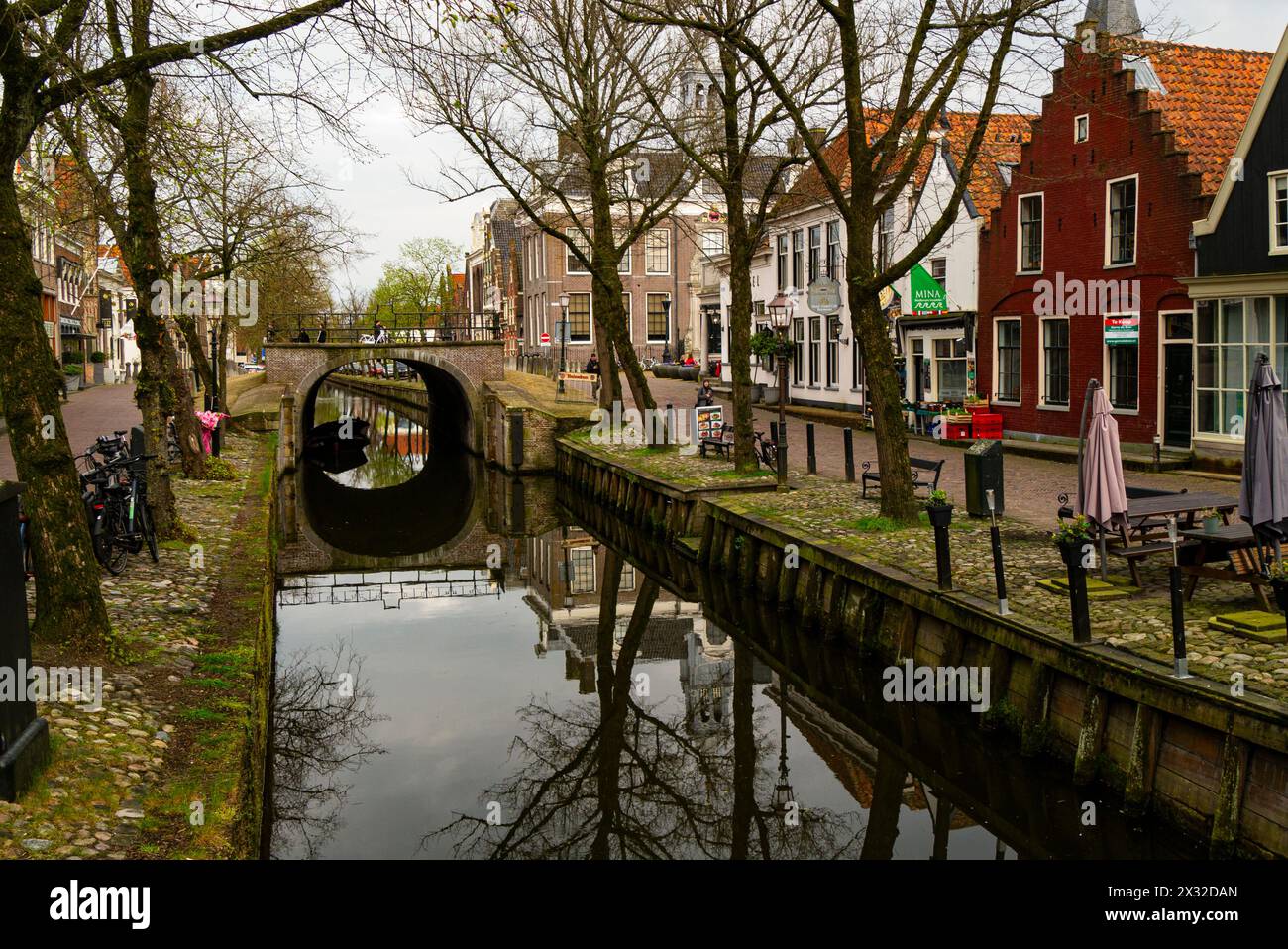 View along canal with road bridge in centre of Edam once a shipbuilding ...