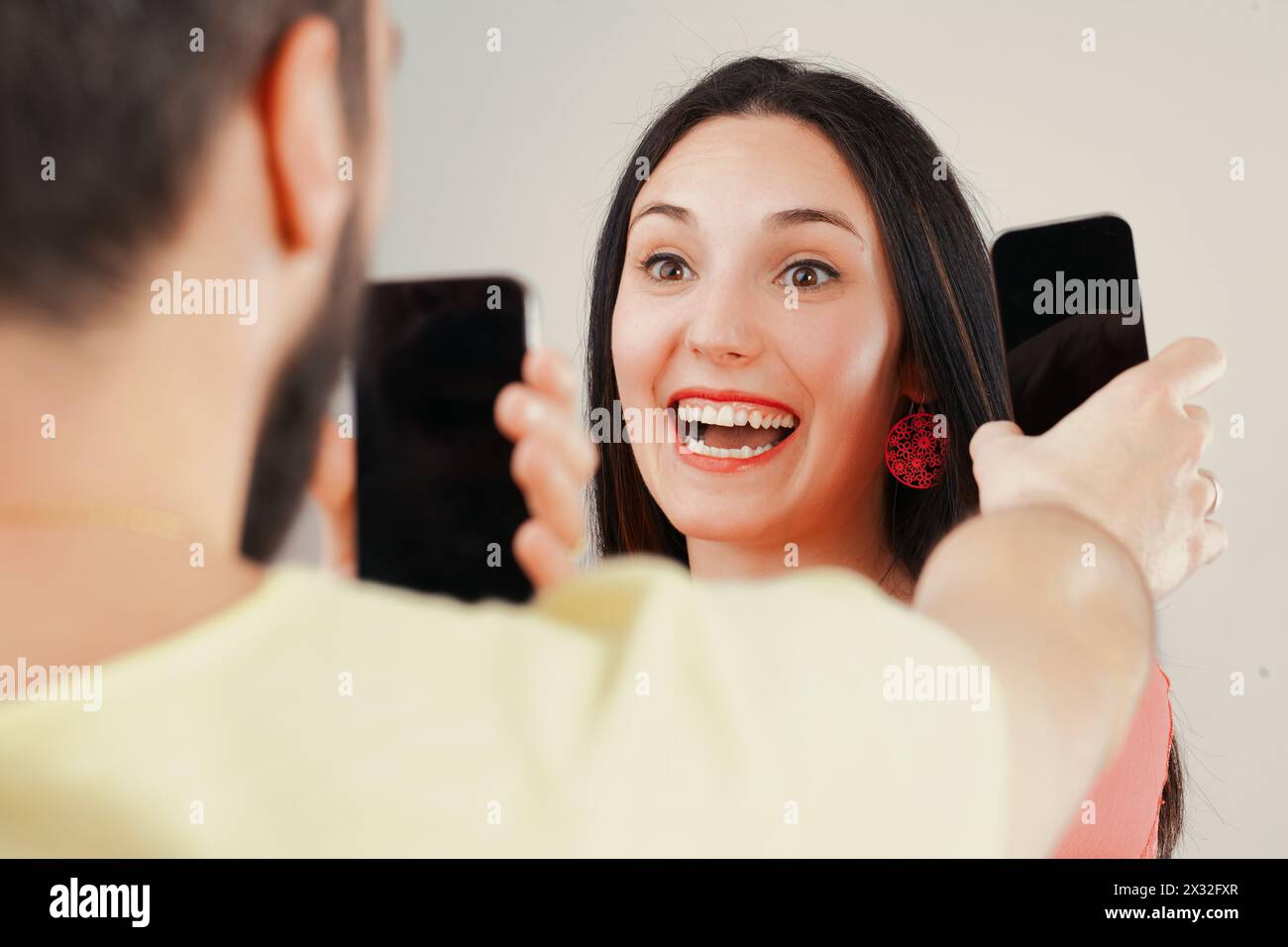 Exchanging smiles and digital content, their interaction is a modern ...