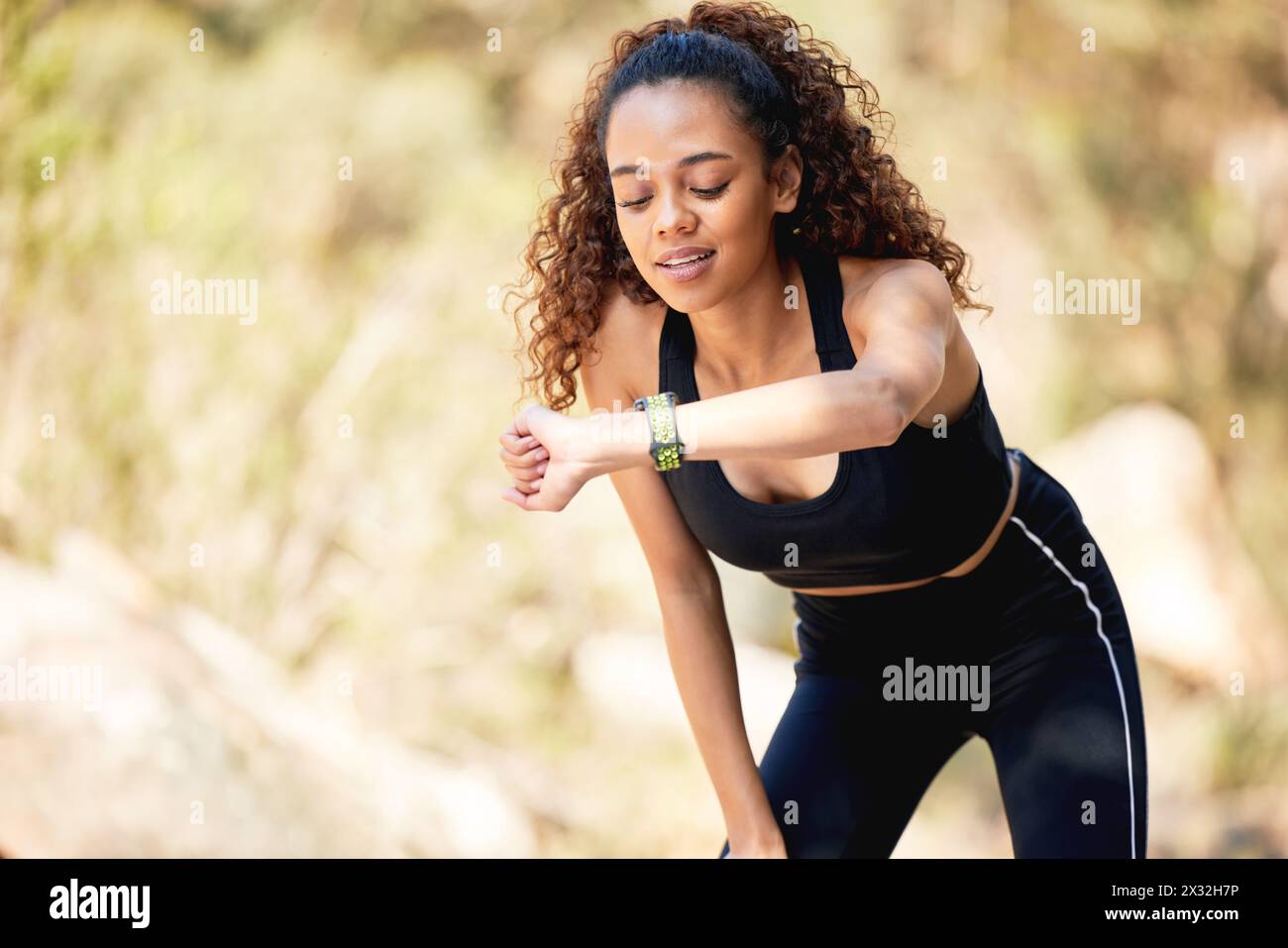 Woman, exercise and smart watch tracking in nature with fitness app for ...