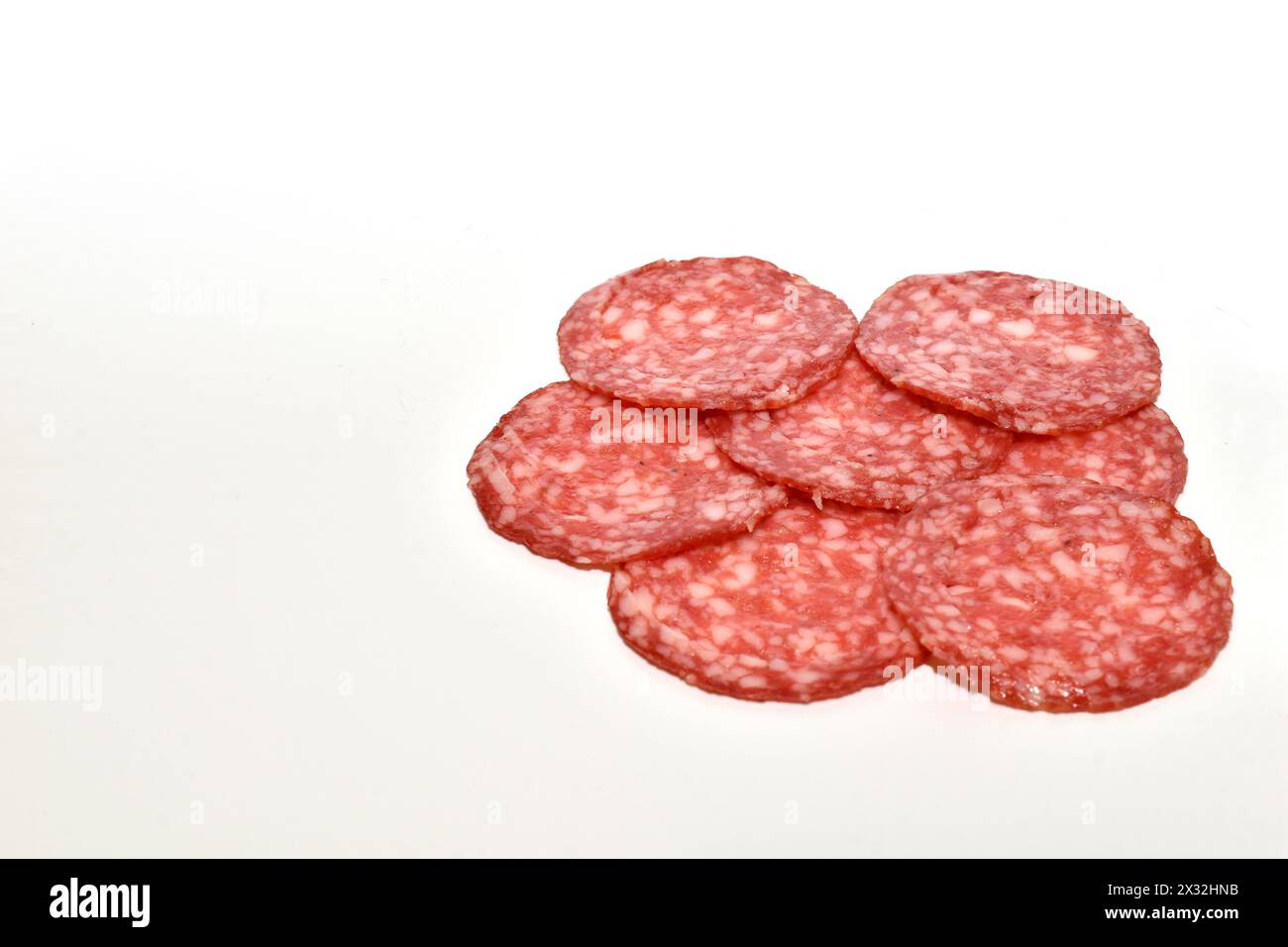 A few rounds of thinly sliced salami, ready to eat Stock Photo - Alamy