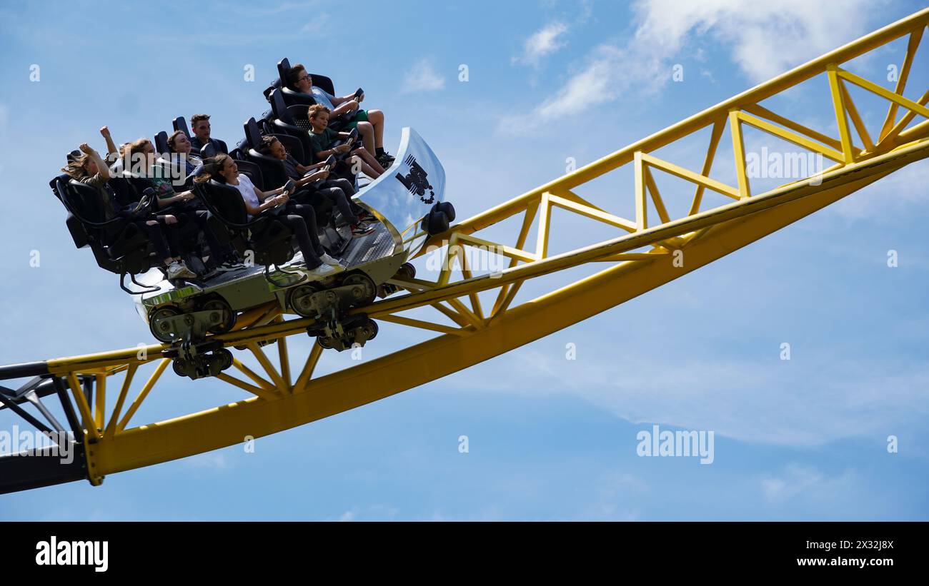 Young people have fun on the "Lost Gravity" rollercoaster at the ...