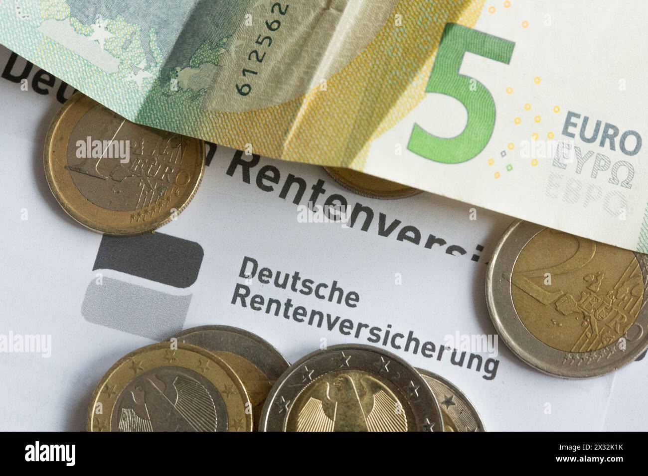 Berlin, Germany. 24th Apr, 2024. Coins lie on a pension information ...