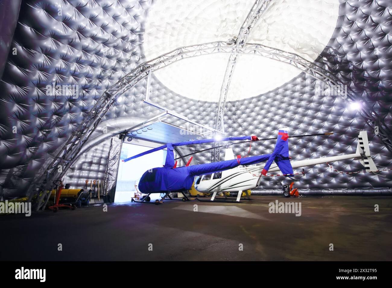 MOSCOW, RUSSIA - DEC 21, 2013: Helicopters in hangar of Heliport Moscow ...