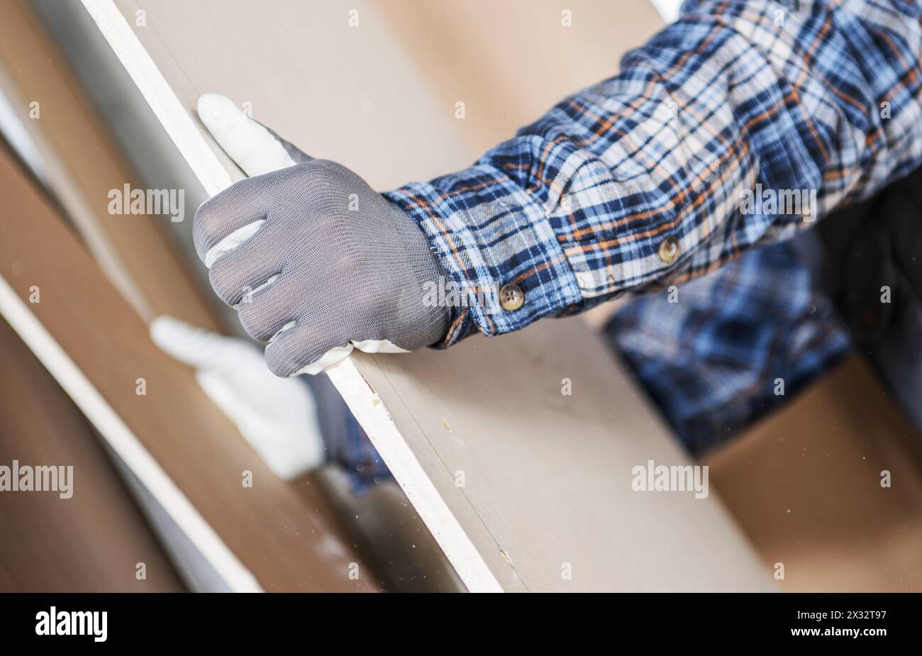Construction Site Worker Moving Piece of a Drywall. Close Up Photo ...