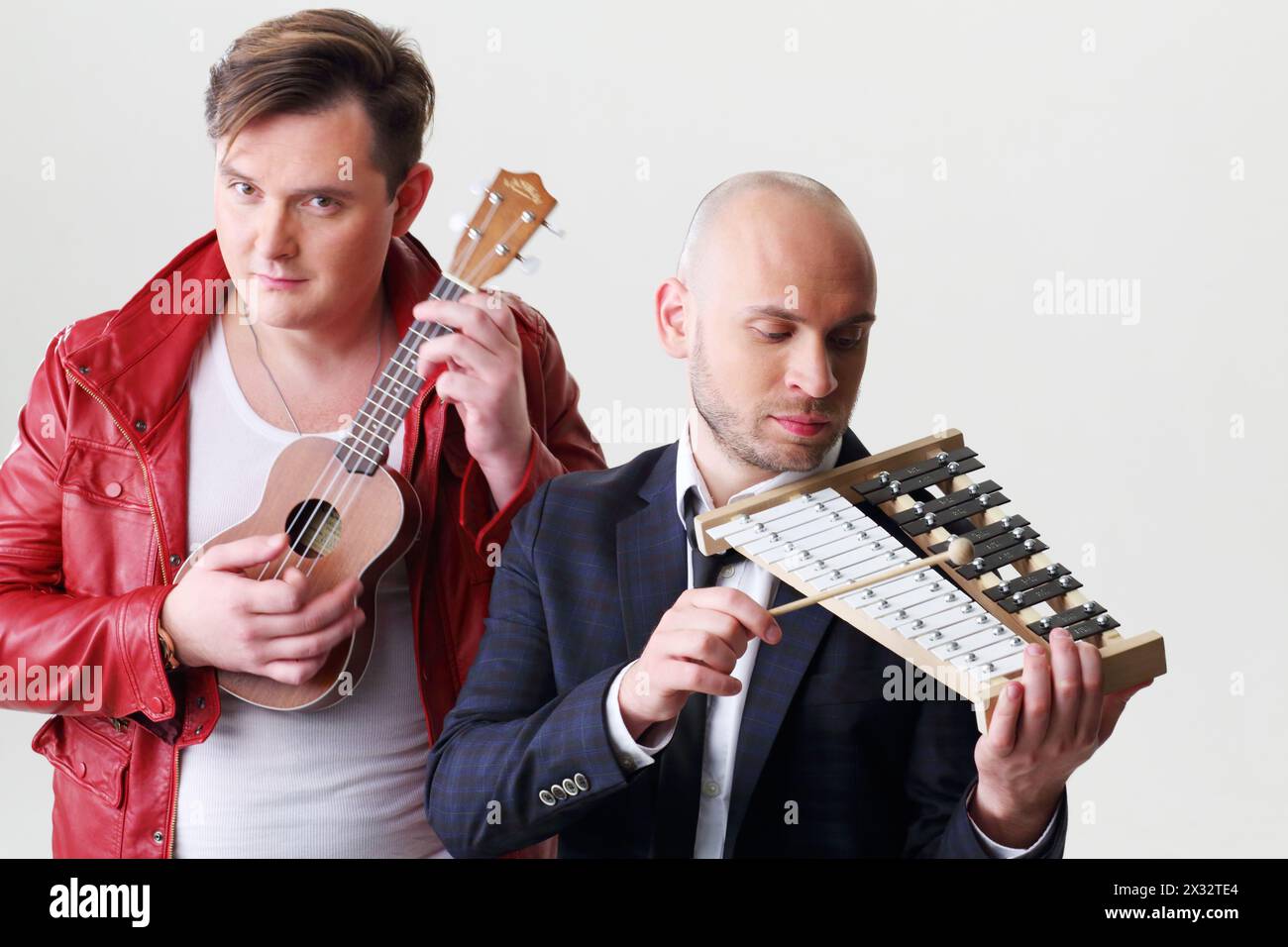 Two men musical instruments hi-res stock photography and images - Alamy