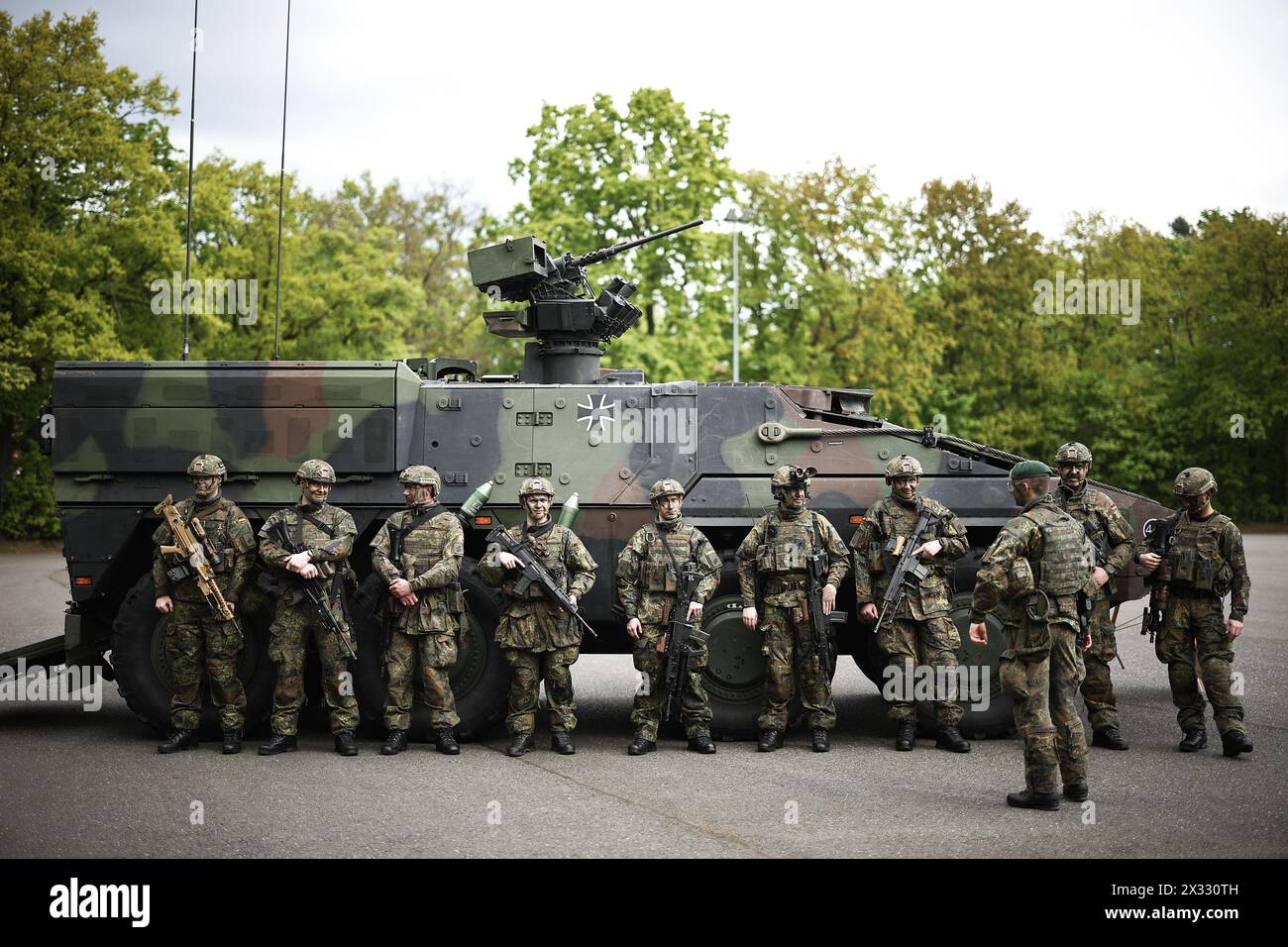 German soldiers stand in front of a Boxer military vehicle, a new type ...