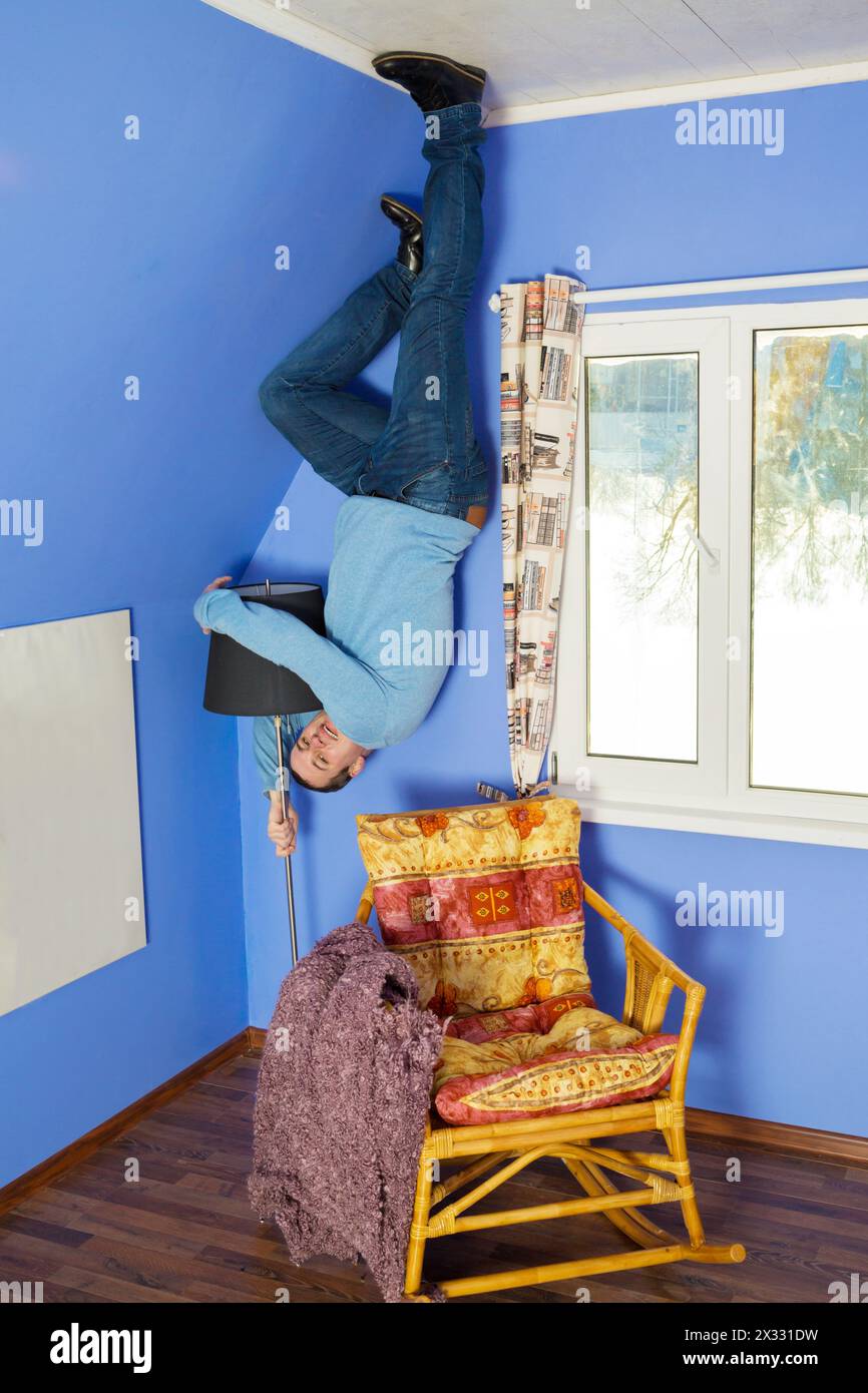 Man home standing on a chair hi-res stock photography and images - Alamy