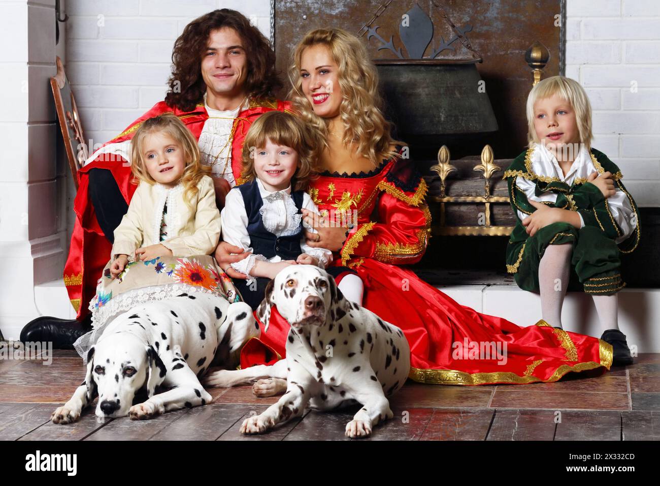 Smiling father, mother, little daughter and two sons in medieval ...