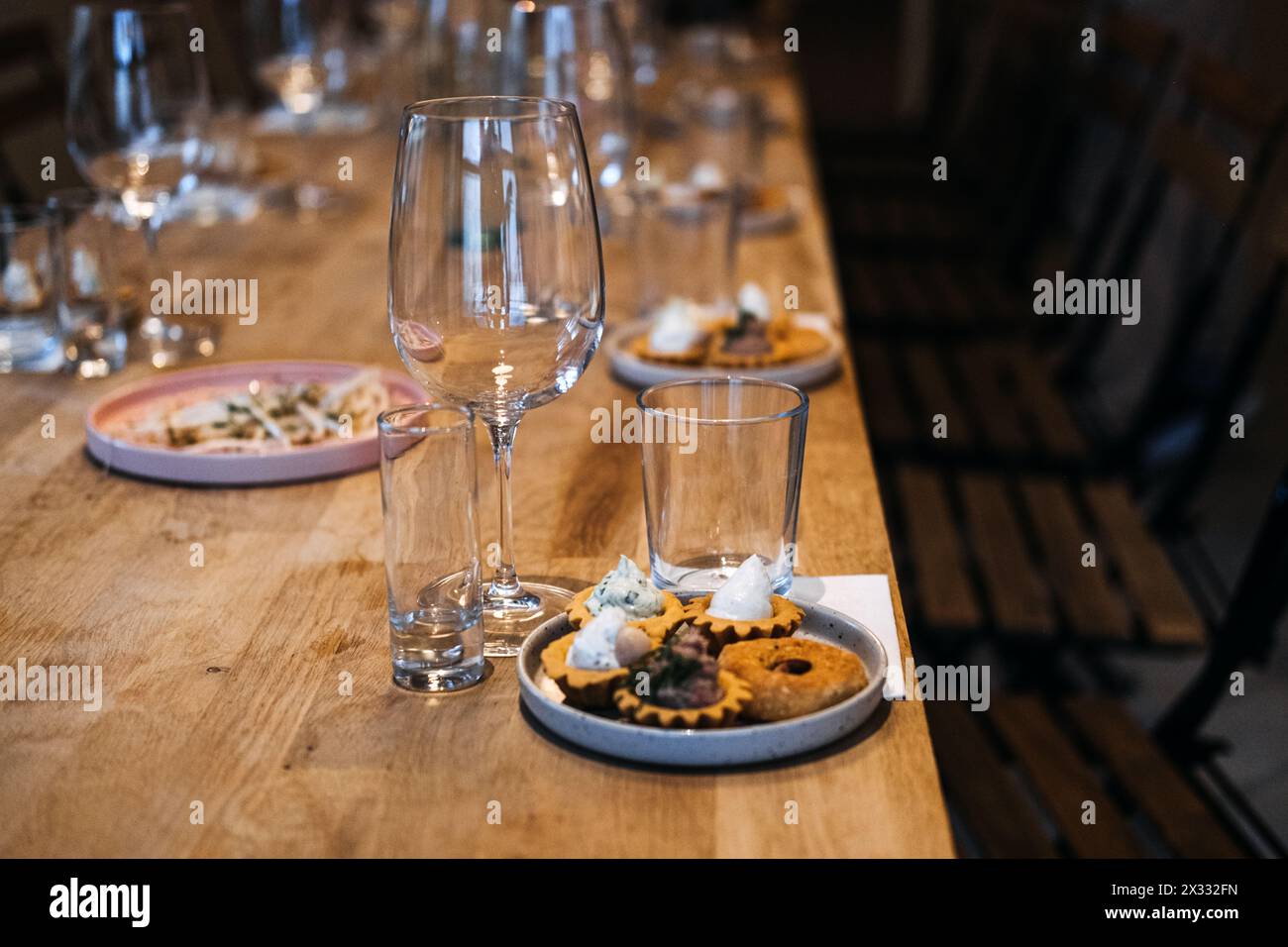 Global Cuisine Sampling Setup for a Wine Tasting Event Stock Photo - Alamy