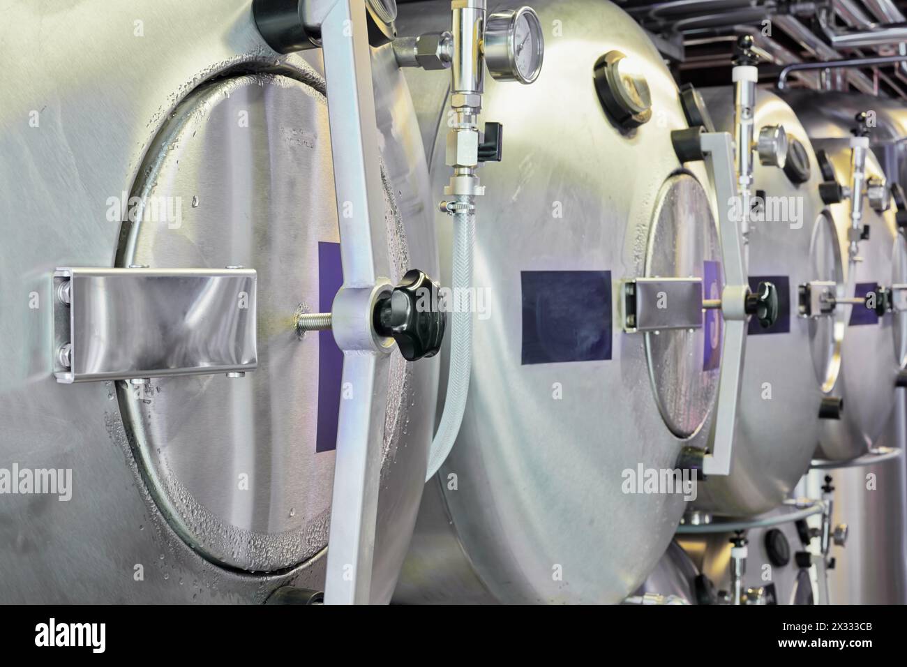 Horizontal tanks at brewery, hatches, covers, locking mechanisms Stock ...