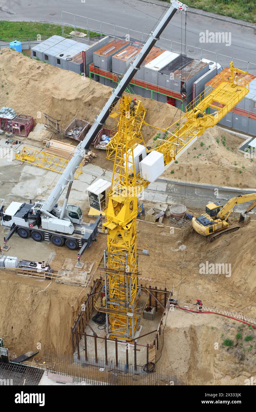 Build of tower crane, excavator and other equipment at construction ...