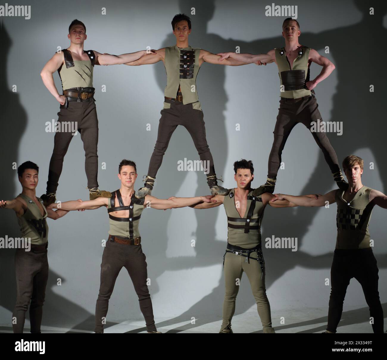 Pyramid of the seven young men standing on each others shoulders Stock ...