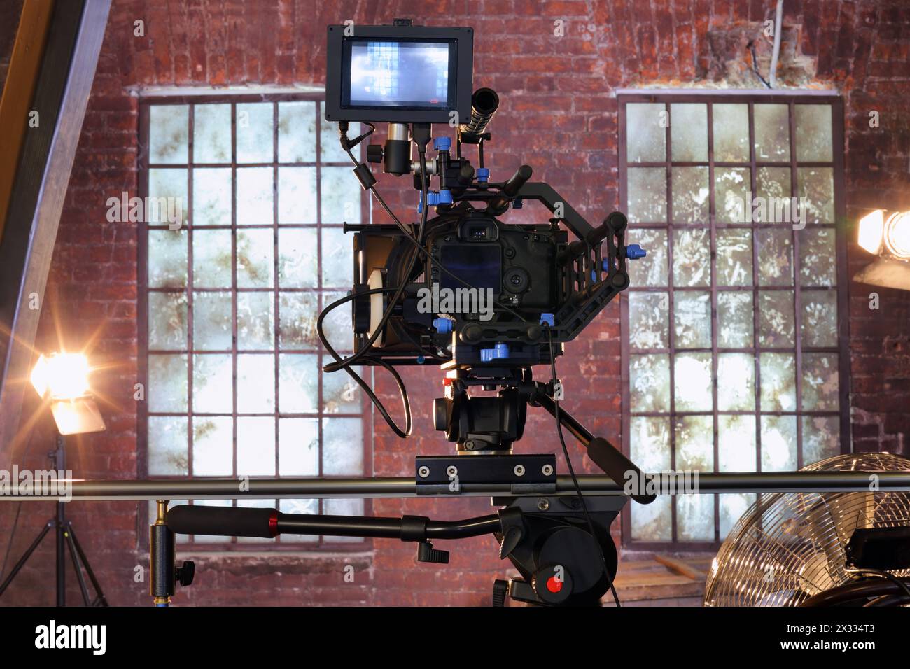 Camera with special devices for shooting video on rail in studio with ...