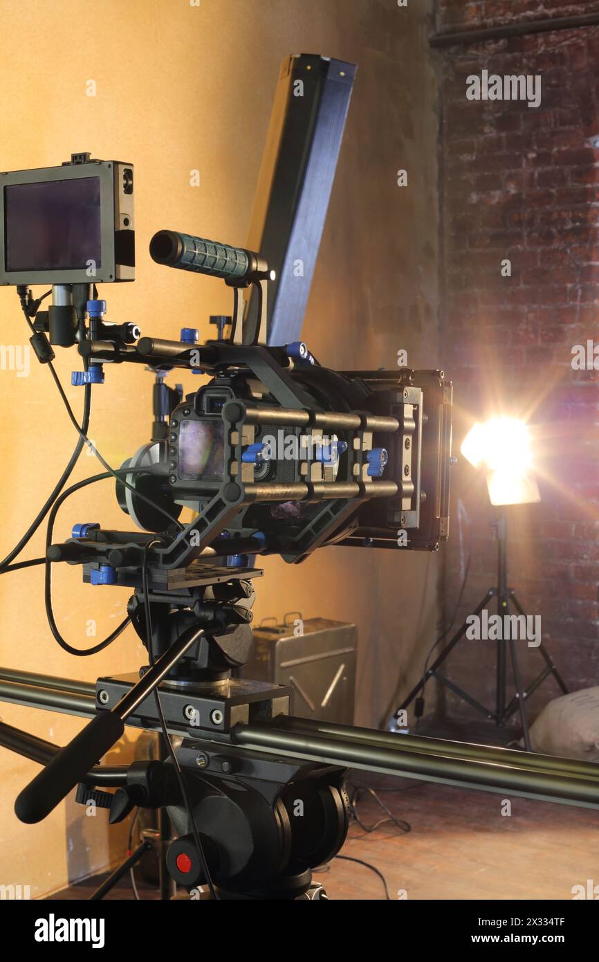Camera with special devices for shooting video on rail in studio with ...