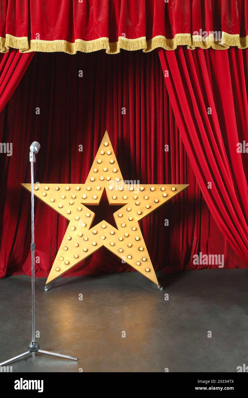 Beautiful big shining star and microphone on red stage Stock Photo - Alamy