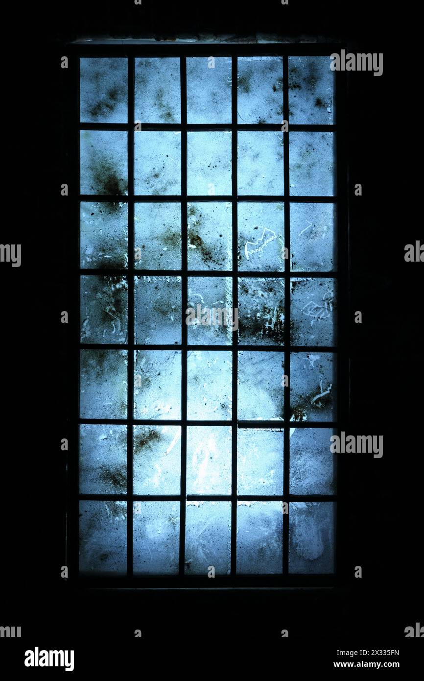 Big old dirty window with blue scratched glasses in dark room Stock ...